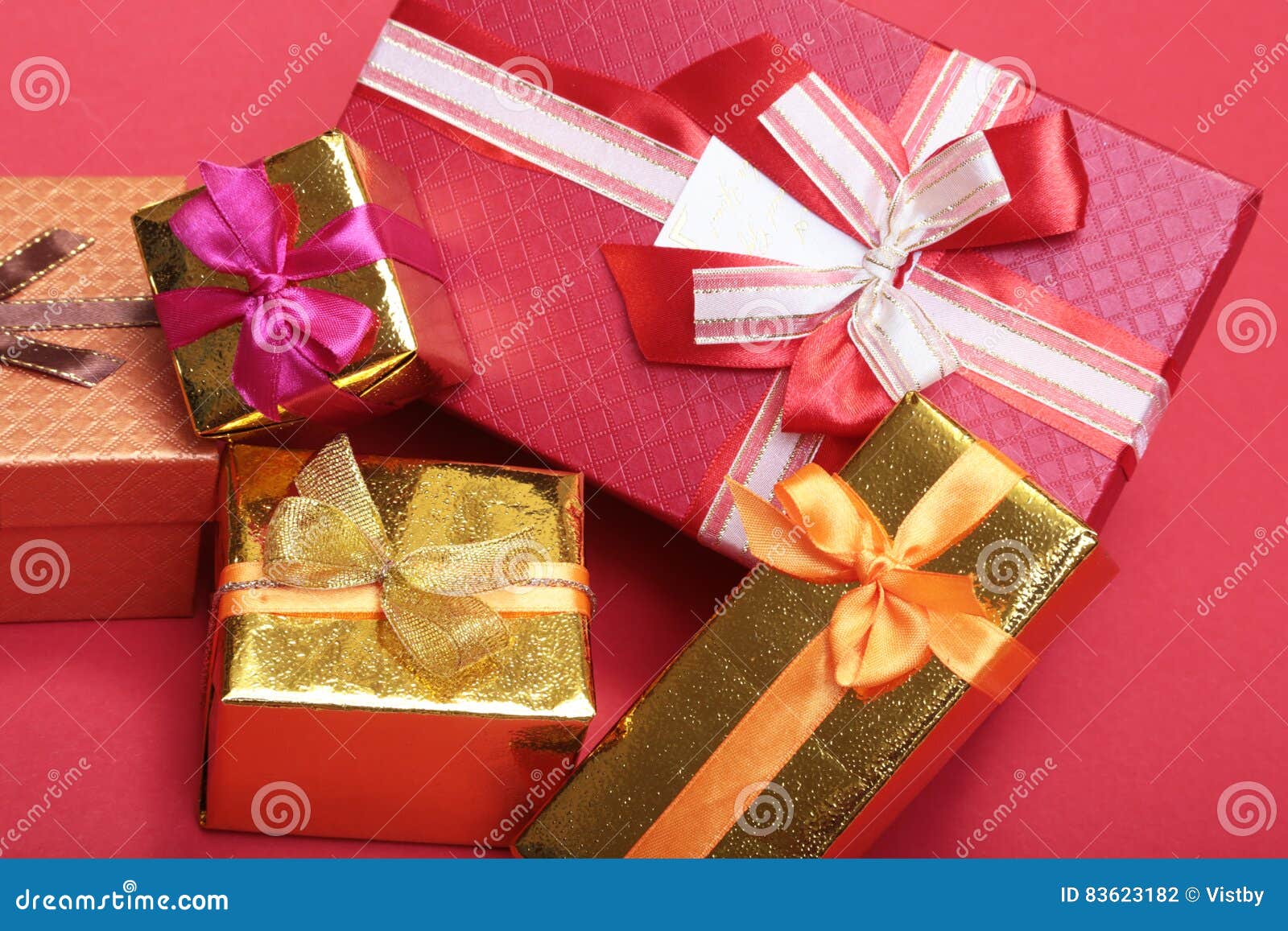 Beautiful Gold Present Box with Red Bow and Ribbons on Backgound Stock ...