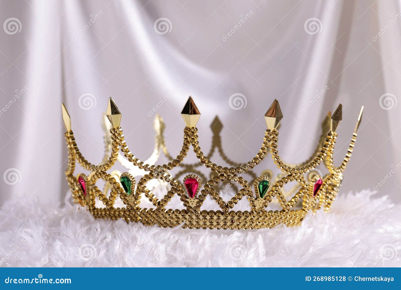 Beautiful Golden Crown with Gems on White Soft Cloth Stock Photo ...
