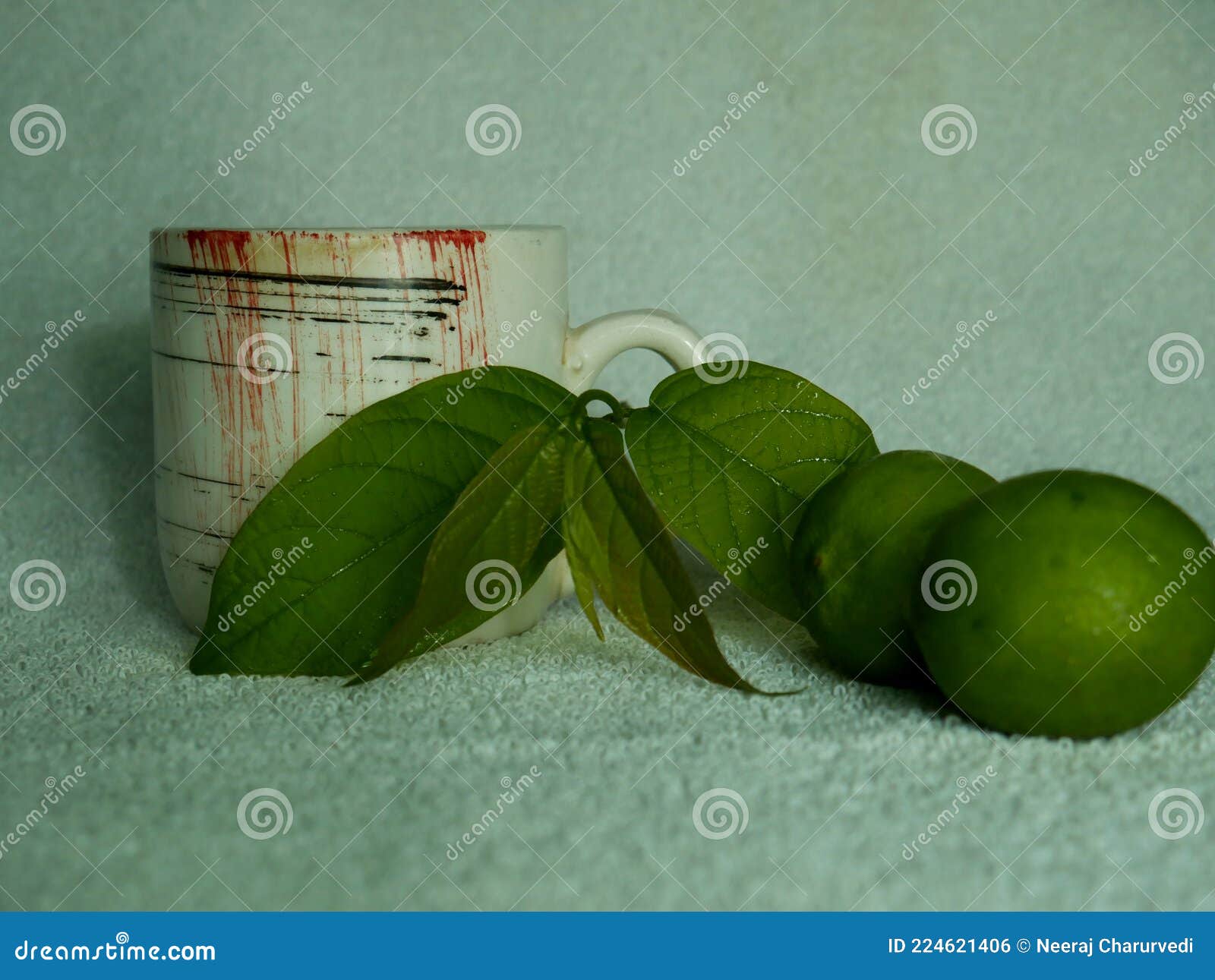 Beautiful Green Lemon with Green Tea Cup Presented at White Backdrop ...
