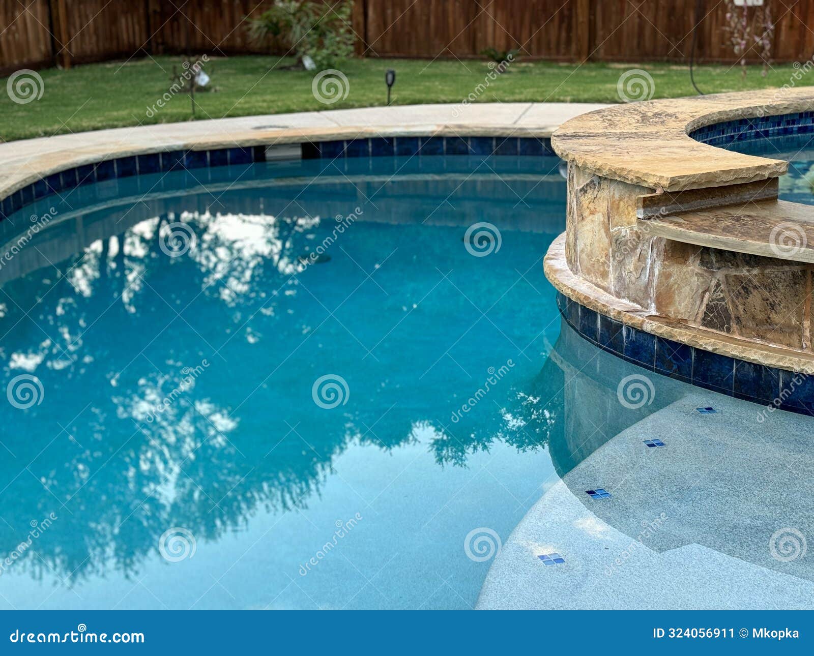 Beautiful in-ground Swimming Pool in a Residential Backyard Stock Image ...