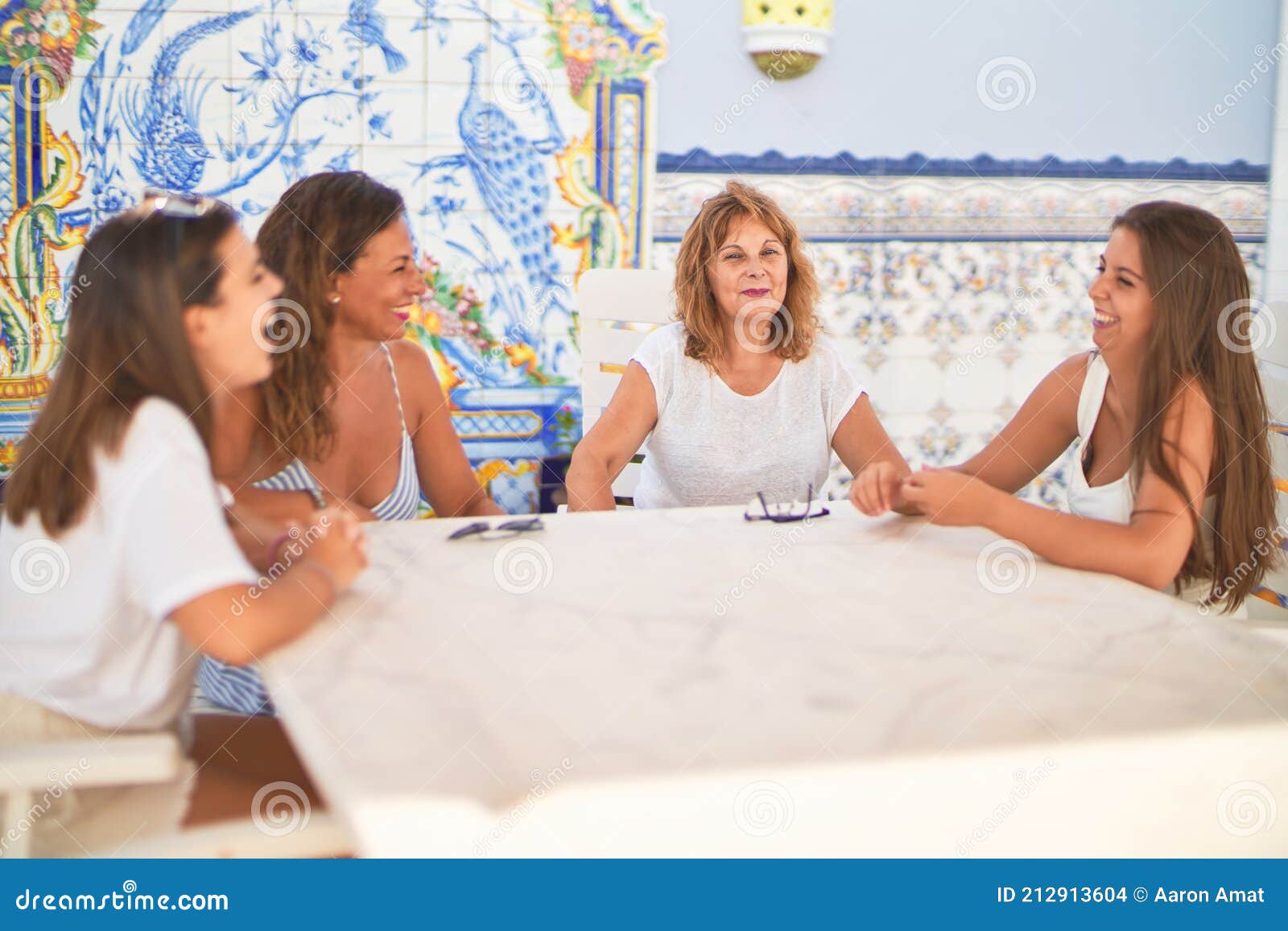 Beautiful Group of Women Sitting at Terrace Speaking and Smiling Stock ...