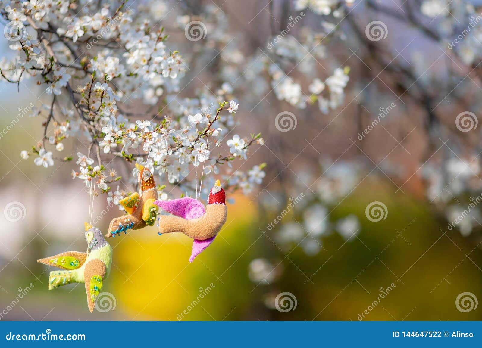 Beautiful Hand Made Colorful Birds Hanging on a Blooming Cherry Tree at ...