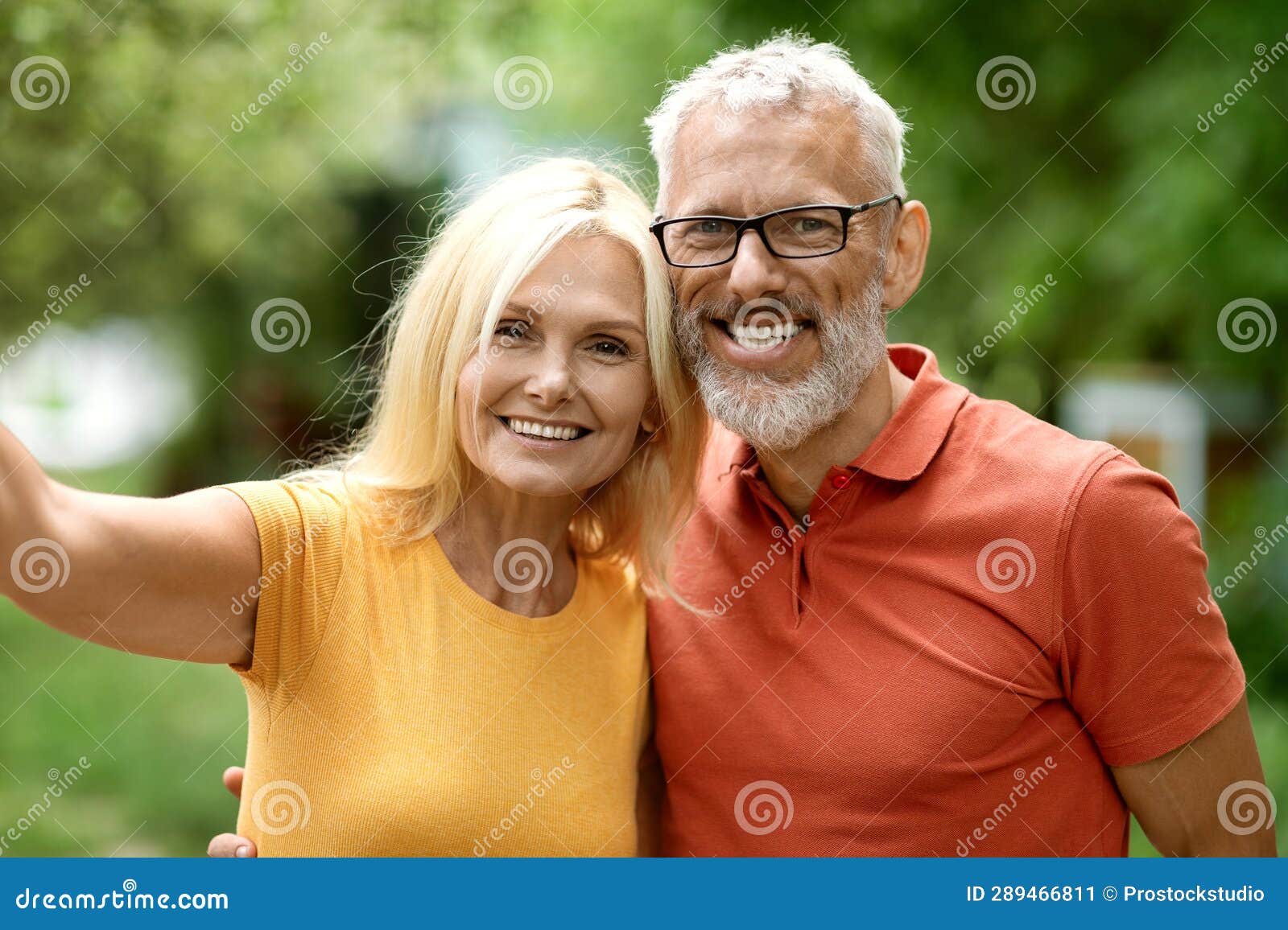 Beautiful Happy Mature Spouses Taking Selfie Outdoors In Garden Stock