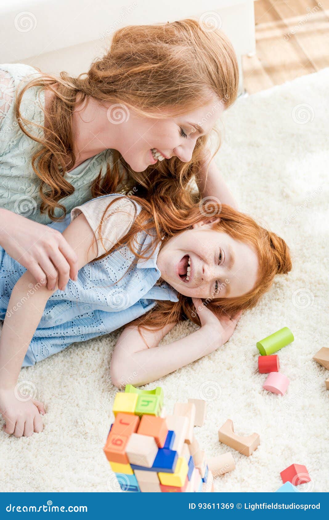 Beautiful Happy Mother And Daughter Having Fun Together At Home Stock