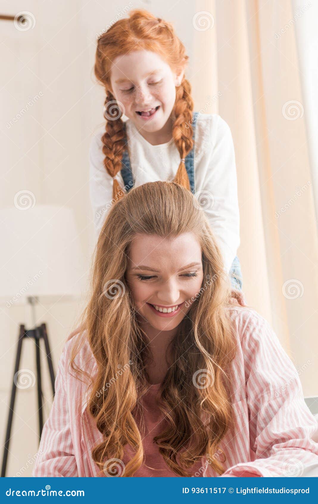 Beautiful Happy Mother And Daughter Having Fun Together At Home Stock