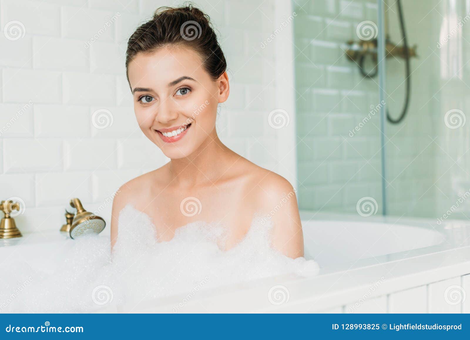 Beautiful Happy Young Woman Smiling at Camera while Relaxing in Bathtub ... Beautiful Happy Young Woman Smiling at Camera while Relaxing in Bathtub ...