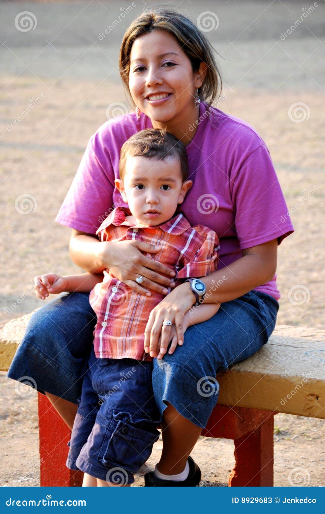 Hispanic Mother And Son Hanging Clothes At Clothesline With Angry Face ...