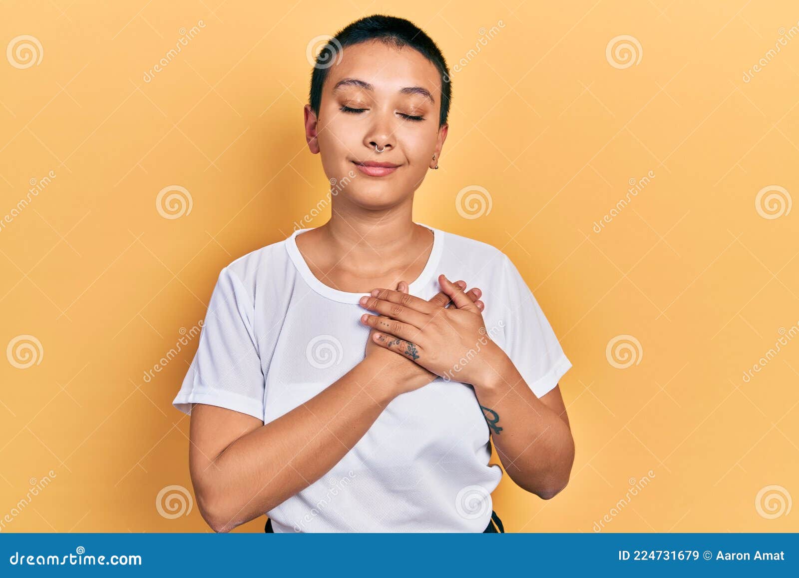 Beautiful Hispanic Woman With Short Hair Wearing Casual White T Shirt