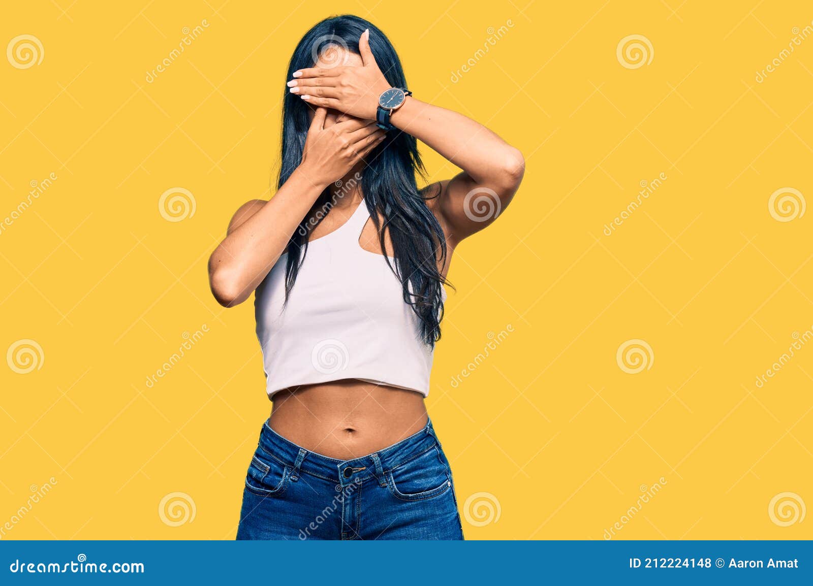 Beautiful Hispanic Woman Wearing Casual Clothes Covering Eyes And Mouth