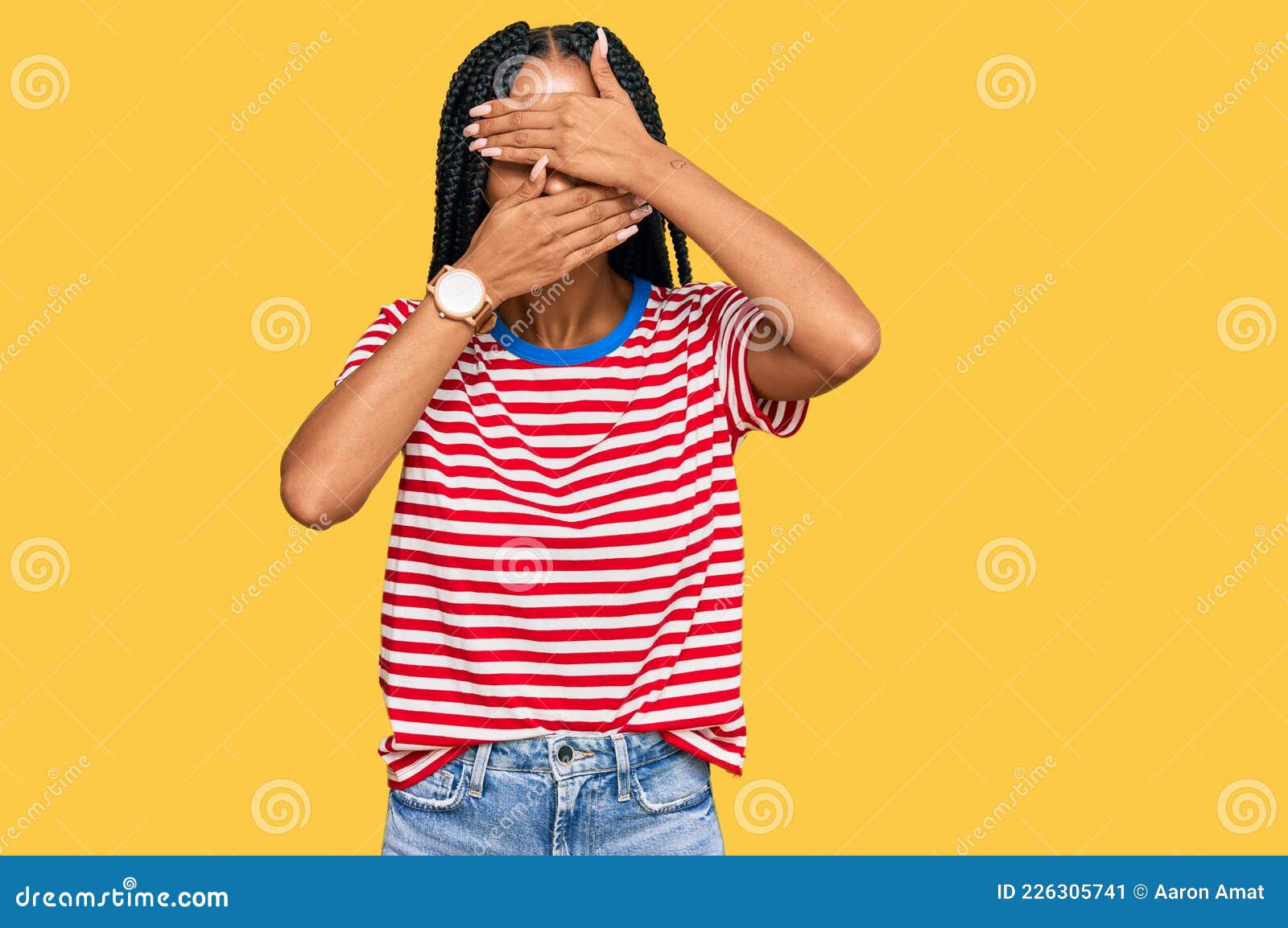 Beautiful Hispanic Woman Wearing Casual Clothes Covering Eyes And Mouth