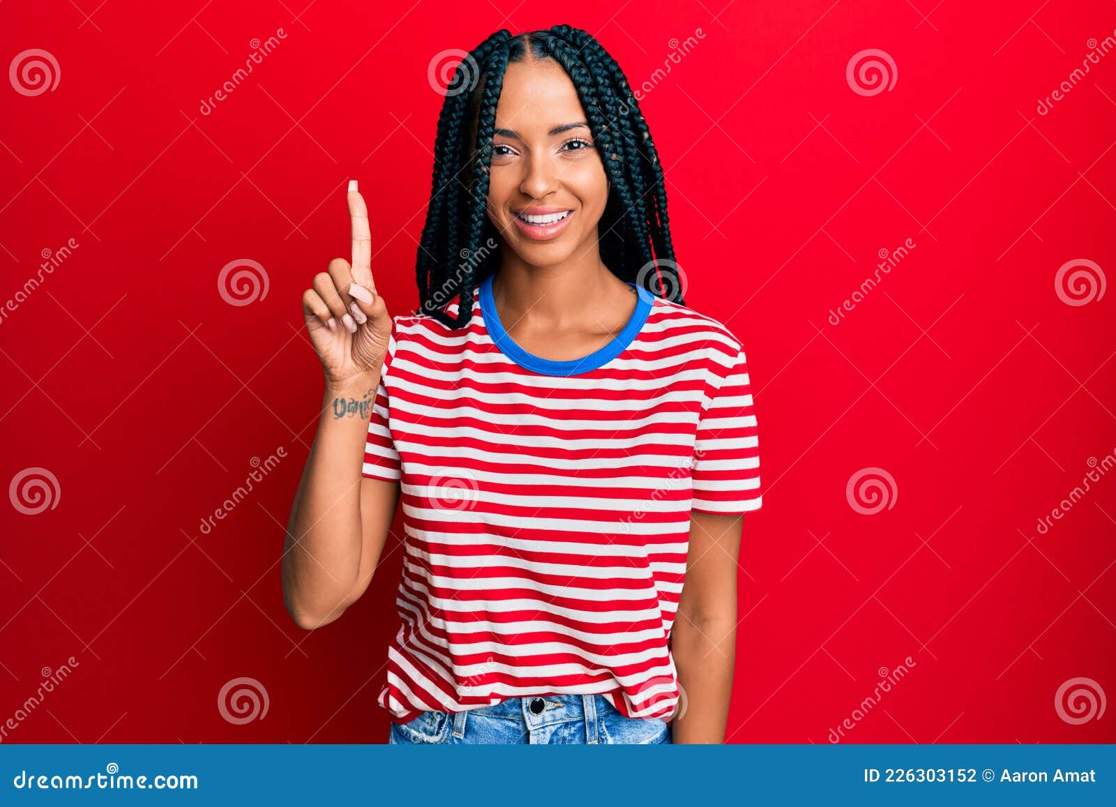 Beautiful Hispanic Woman Wearing Casual Clothes Showing And Pointing Up