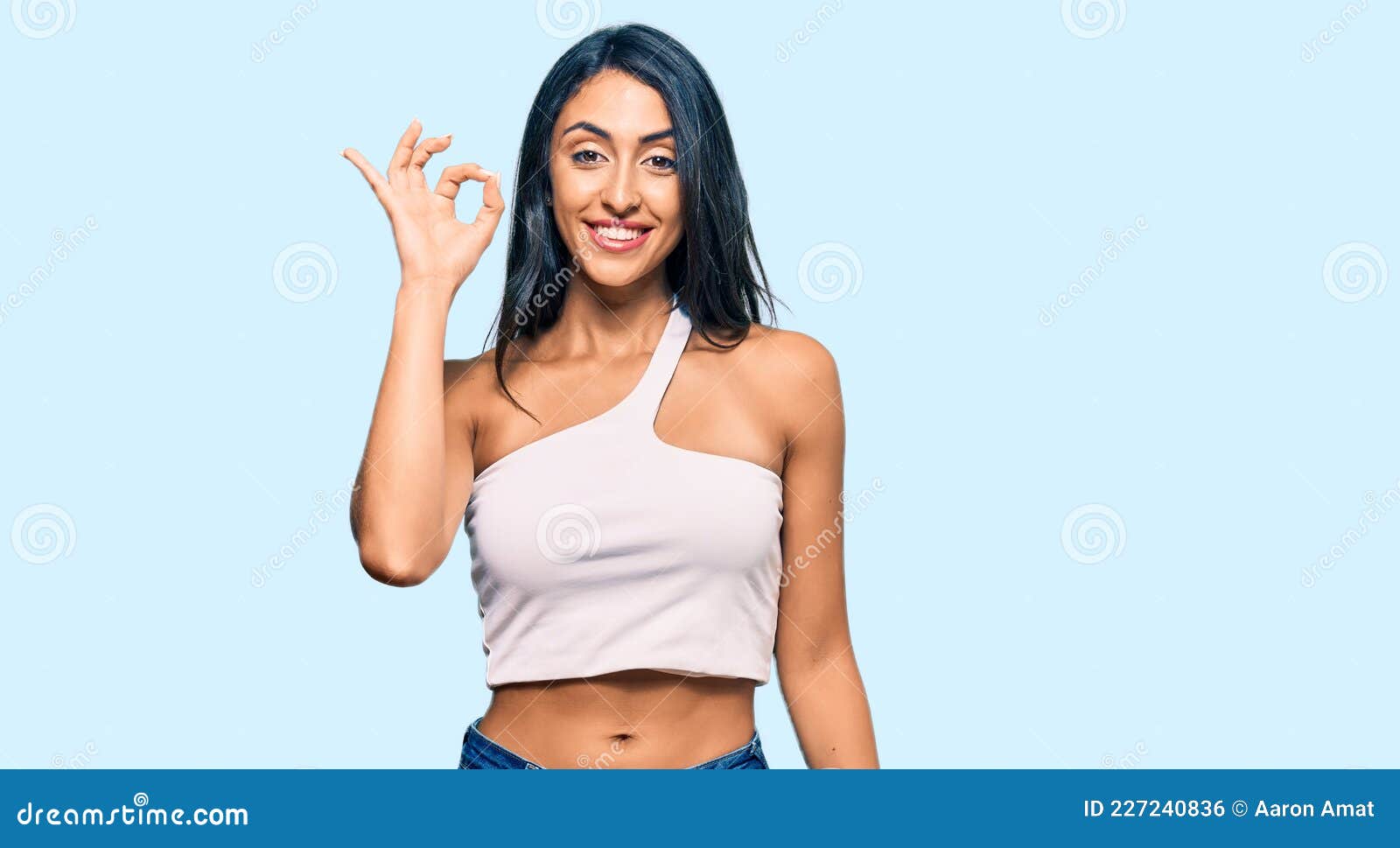 Beautiful Hispanic Woman Wearing Casual Clothes Smiling Positive Doing
