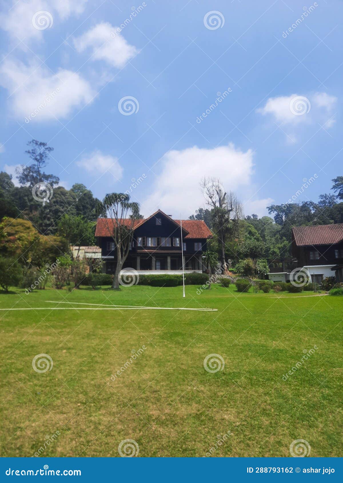 Beautiful and Beautiful House with a Large Green Grassy Yard Stock ...