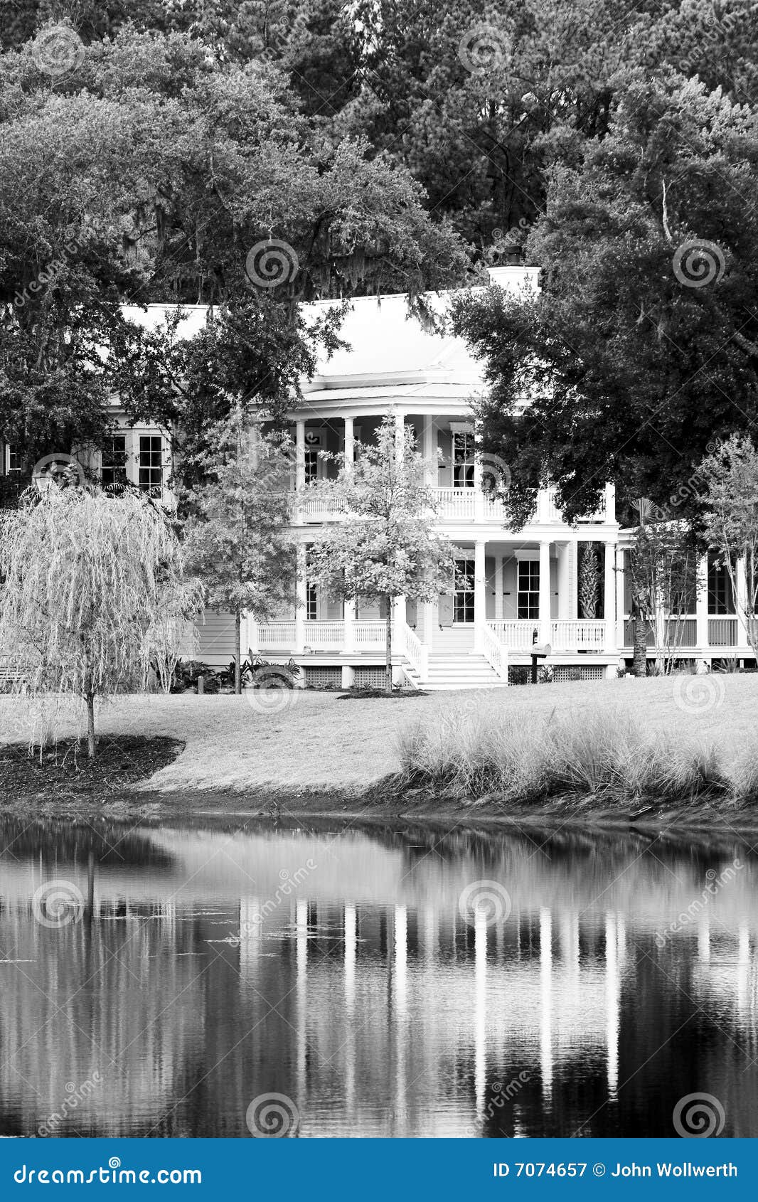 Beautiful house on pond stock image. Image of neigborhood - 7074657