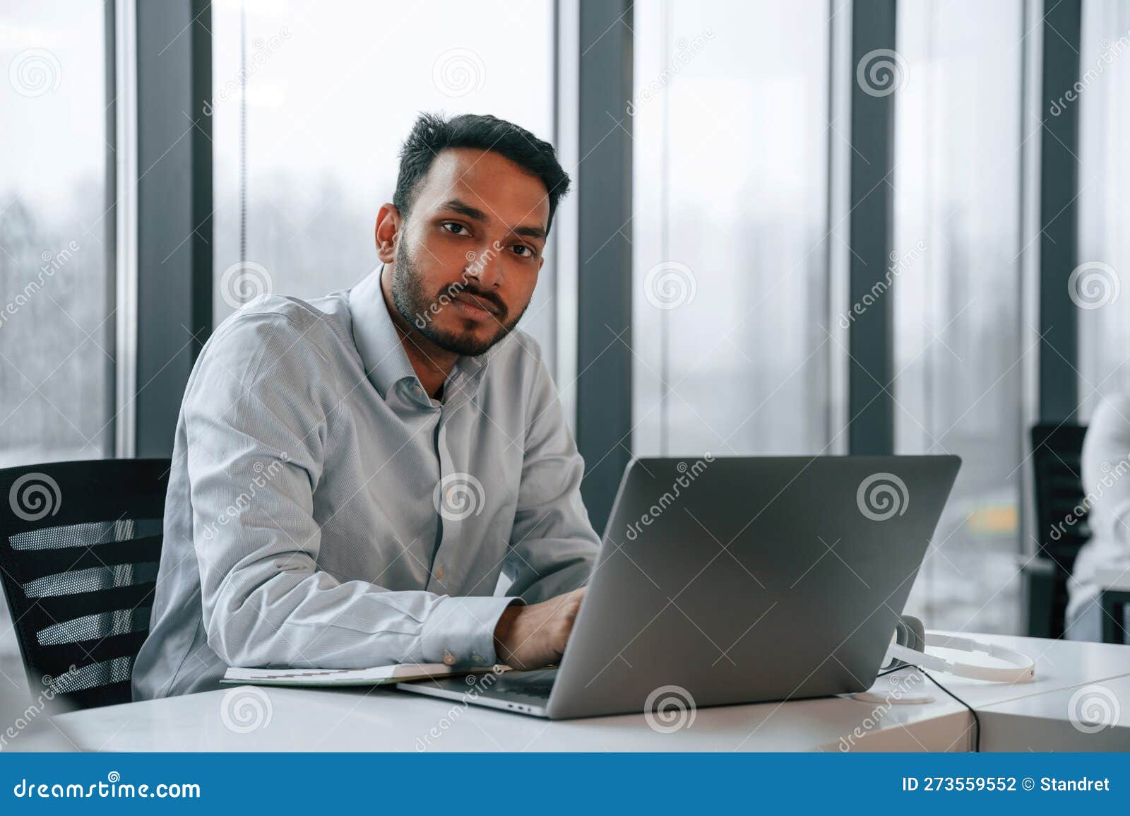Beautiful Indian Man is Working in the Office by Laptop Stock Photo ...