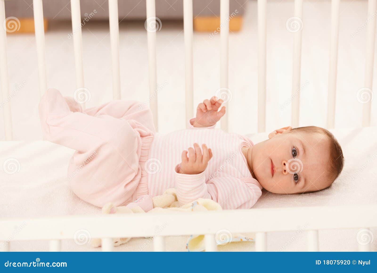 Beautiful infant in crib stock photo. Image of child - 18075920