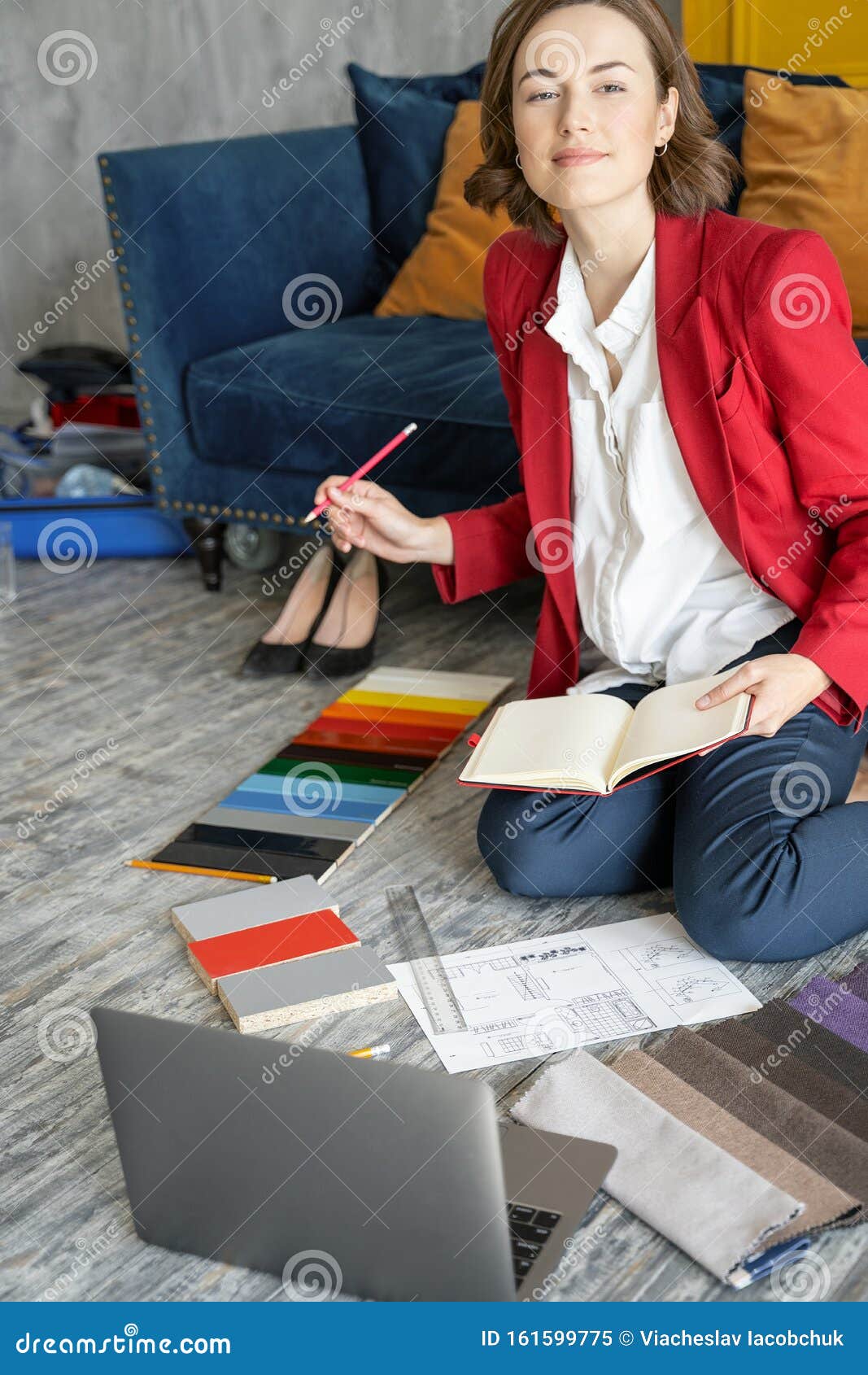 Pleased Young Interior Designer Sitting on the Floor Stock Image ...
