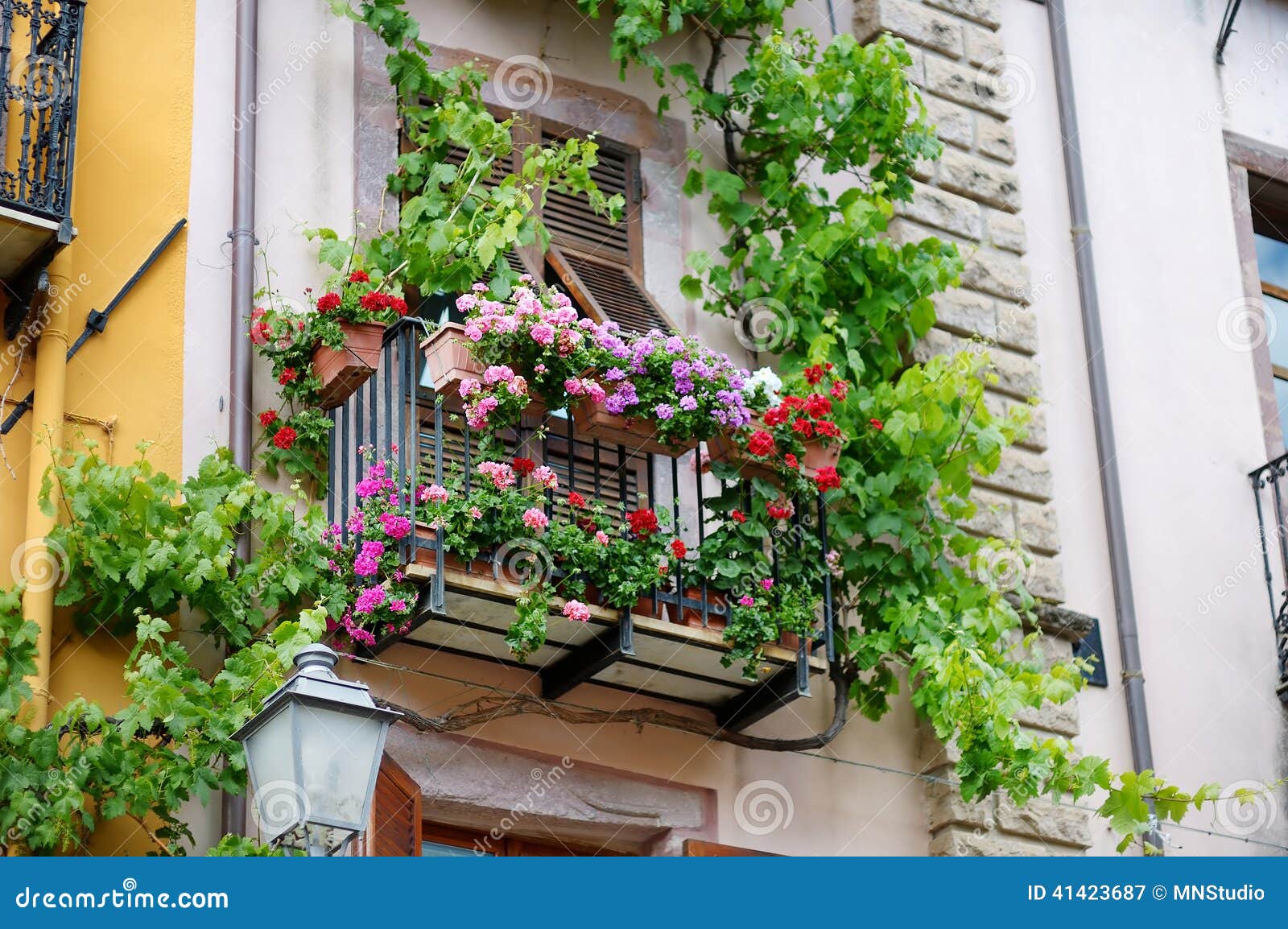 Beautiful italian balcony stock image. Image of flowers - 41423687