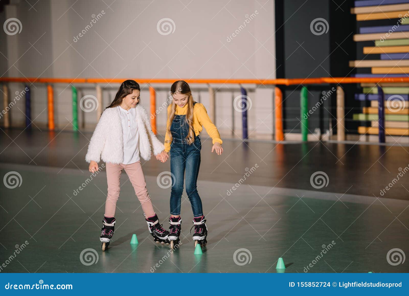 Beautiful Kids Practicing Rolling Skating while Stock Photo - Image of ...
