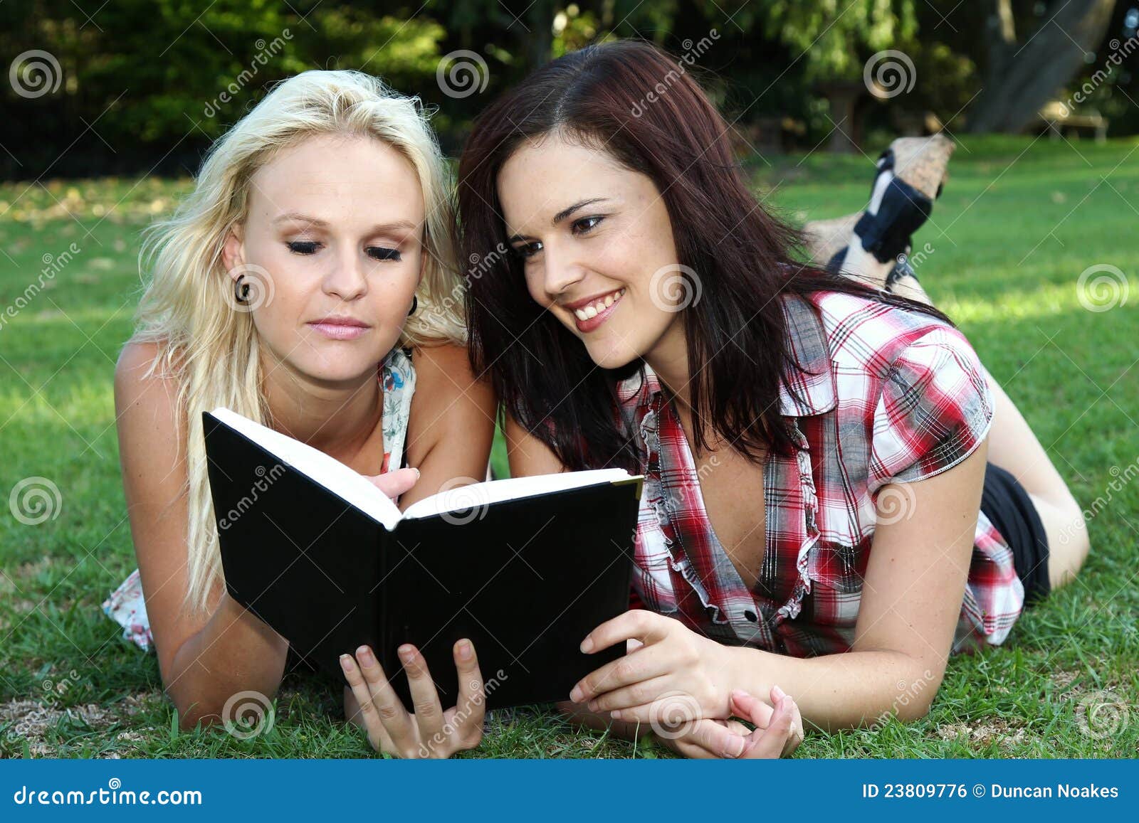Beautiful Ladies Reading Book Stock Photo - Image of outdoors ...