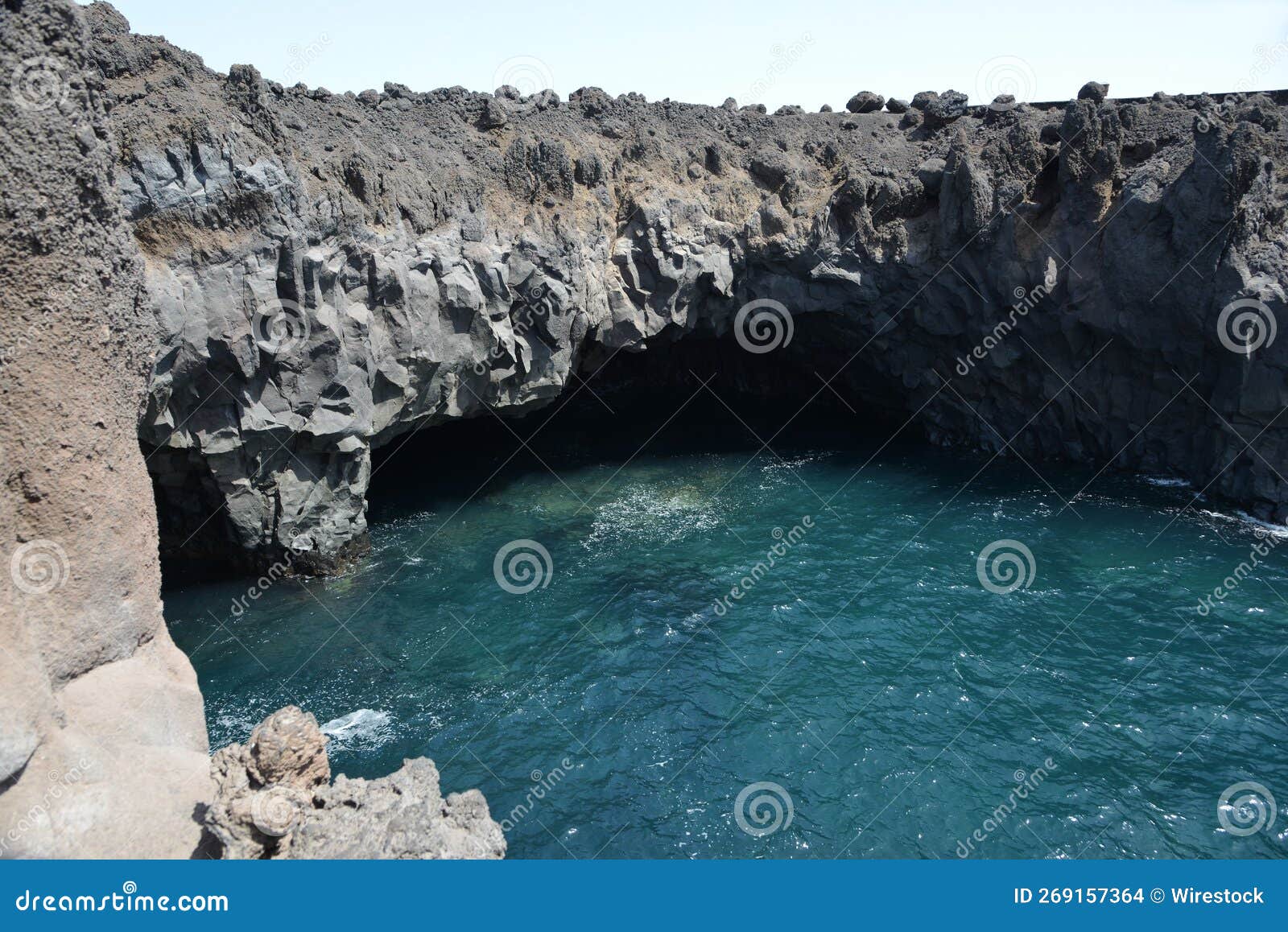 Beautiful Lagoon Under a Rocky Cliff with a Cave Stock Photo - Image of ...