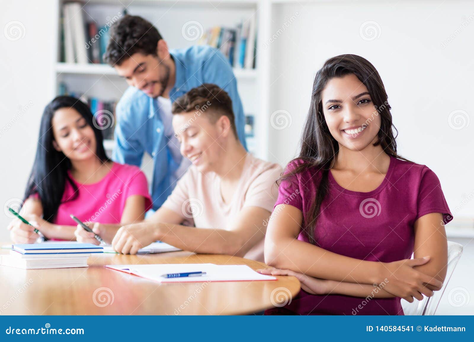 Beautiful Latin American Female Student Learning with Group of Students ...