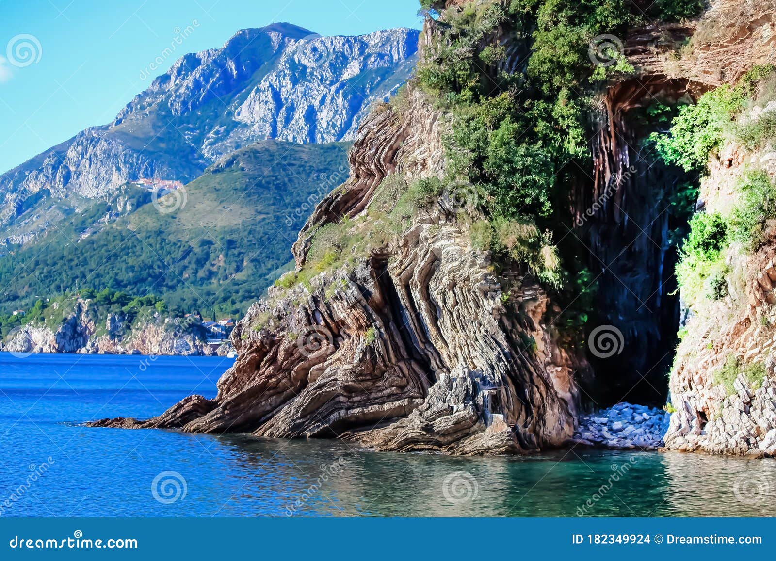 Beautiful Layered Cliffs on a Background of Blue Sea Stock Photo ...