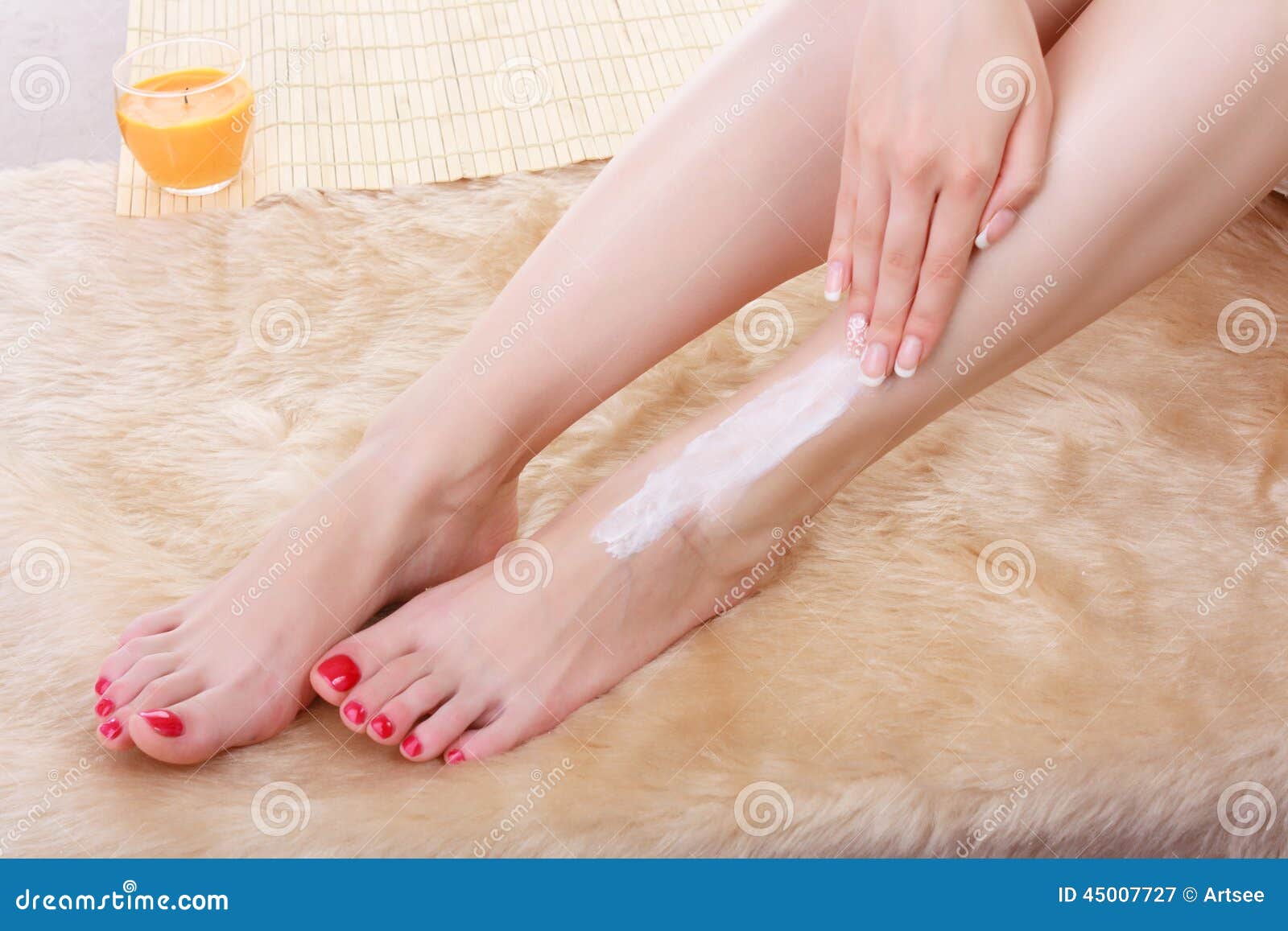 The Beautiful Legs of the Girl Smeared with White Cream. Stock Image ...