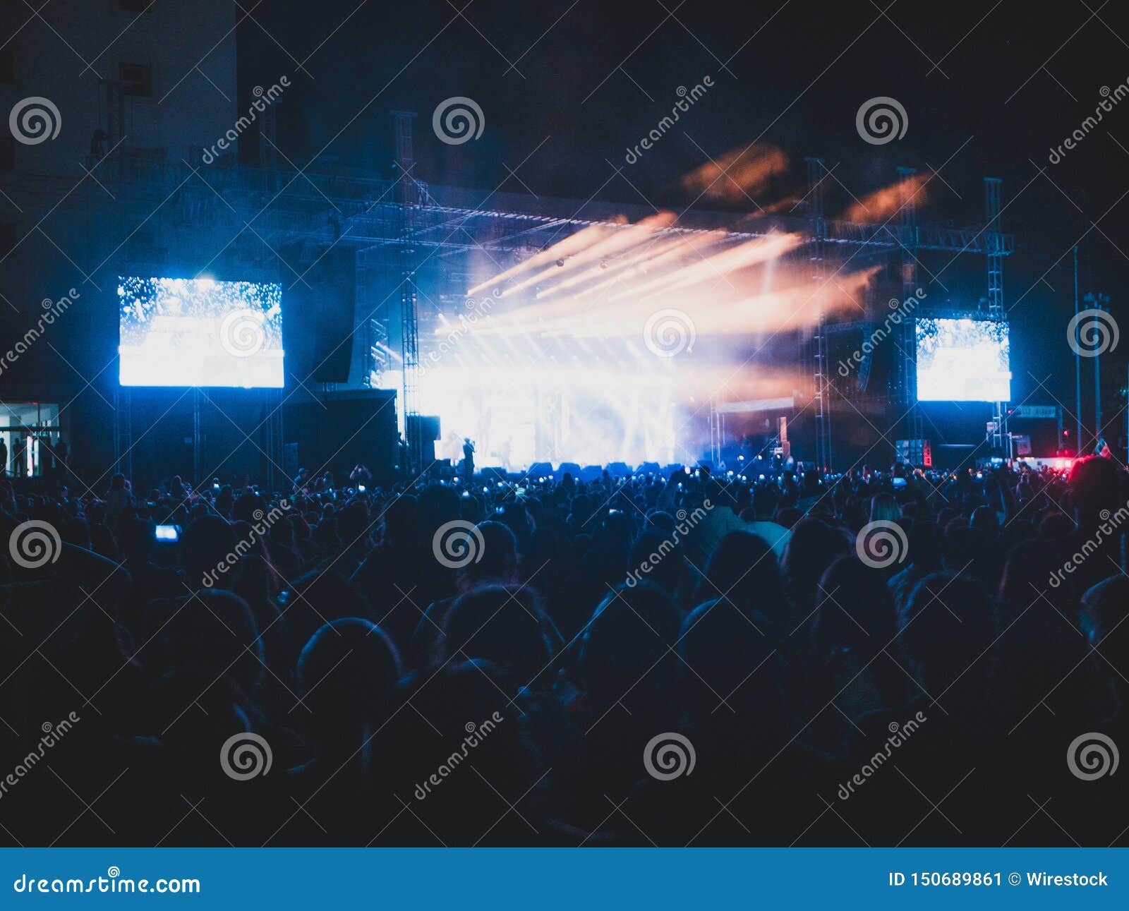Beautiful Lights from the Stage at a Large Concert with Large Crowd ...