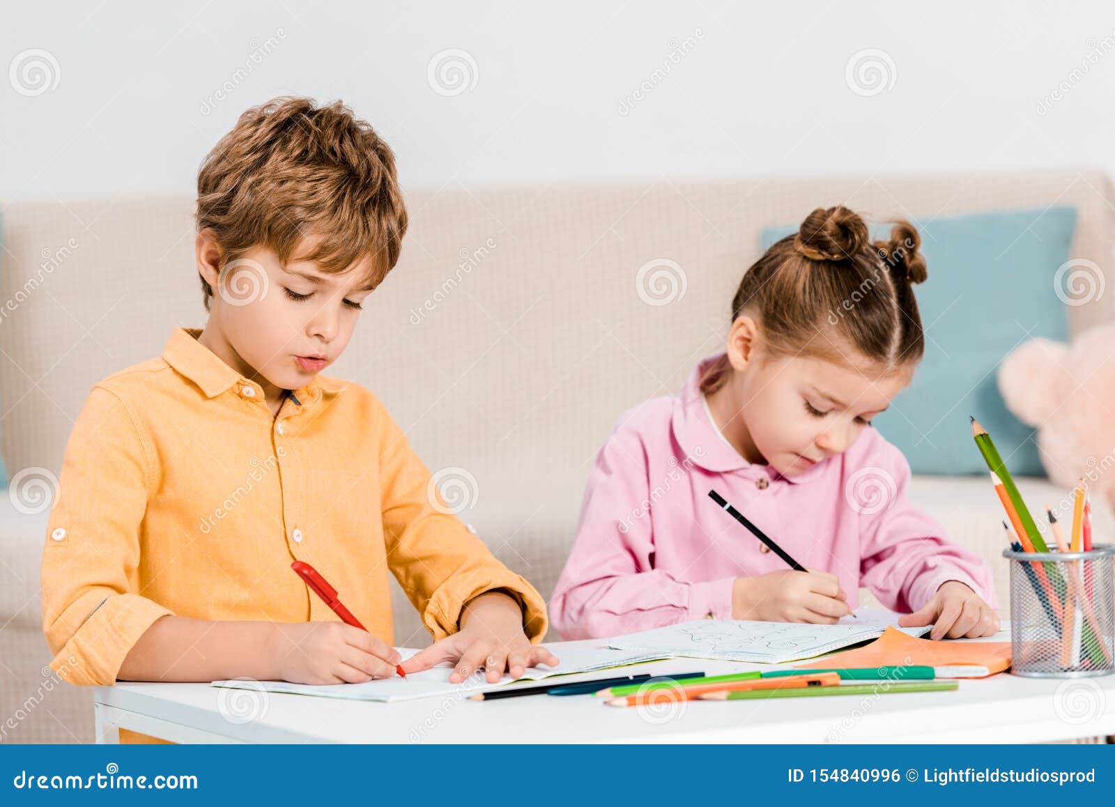 Beautiful Little Children Writing and Stock Photo - Image of study ...