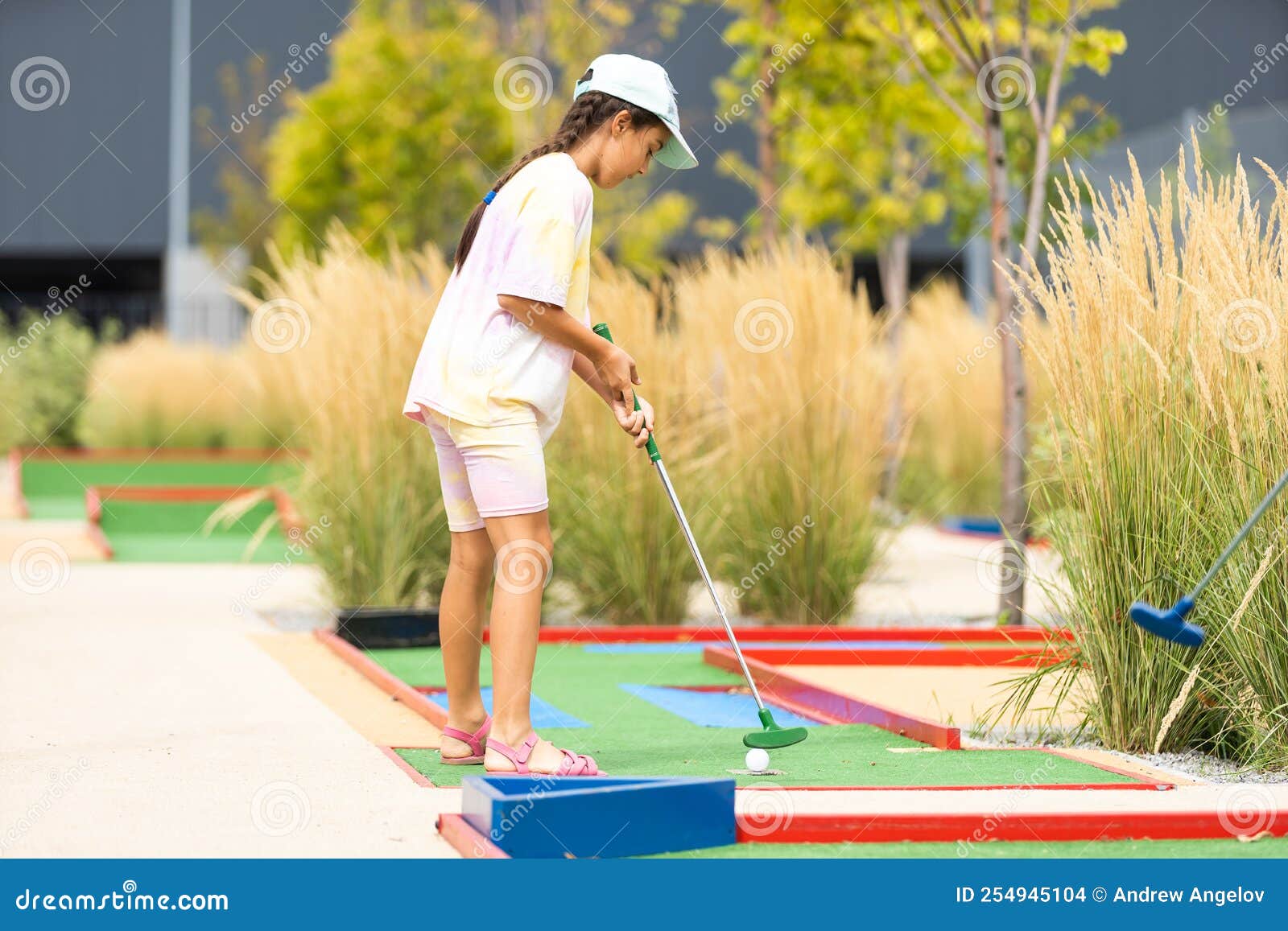 Beautiful Little Girl Playing Mini Golf Stock Photo - Image of ...