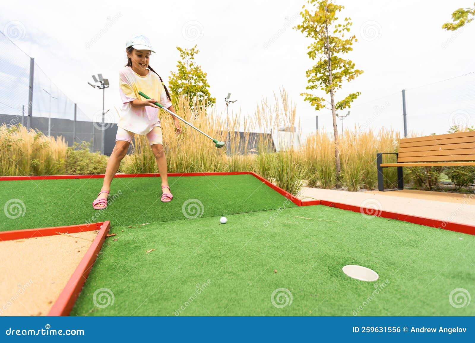 Beautiful Little Girl Playing Mini Golf Stock Photo - Image of little ...