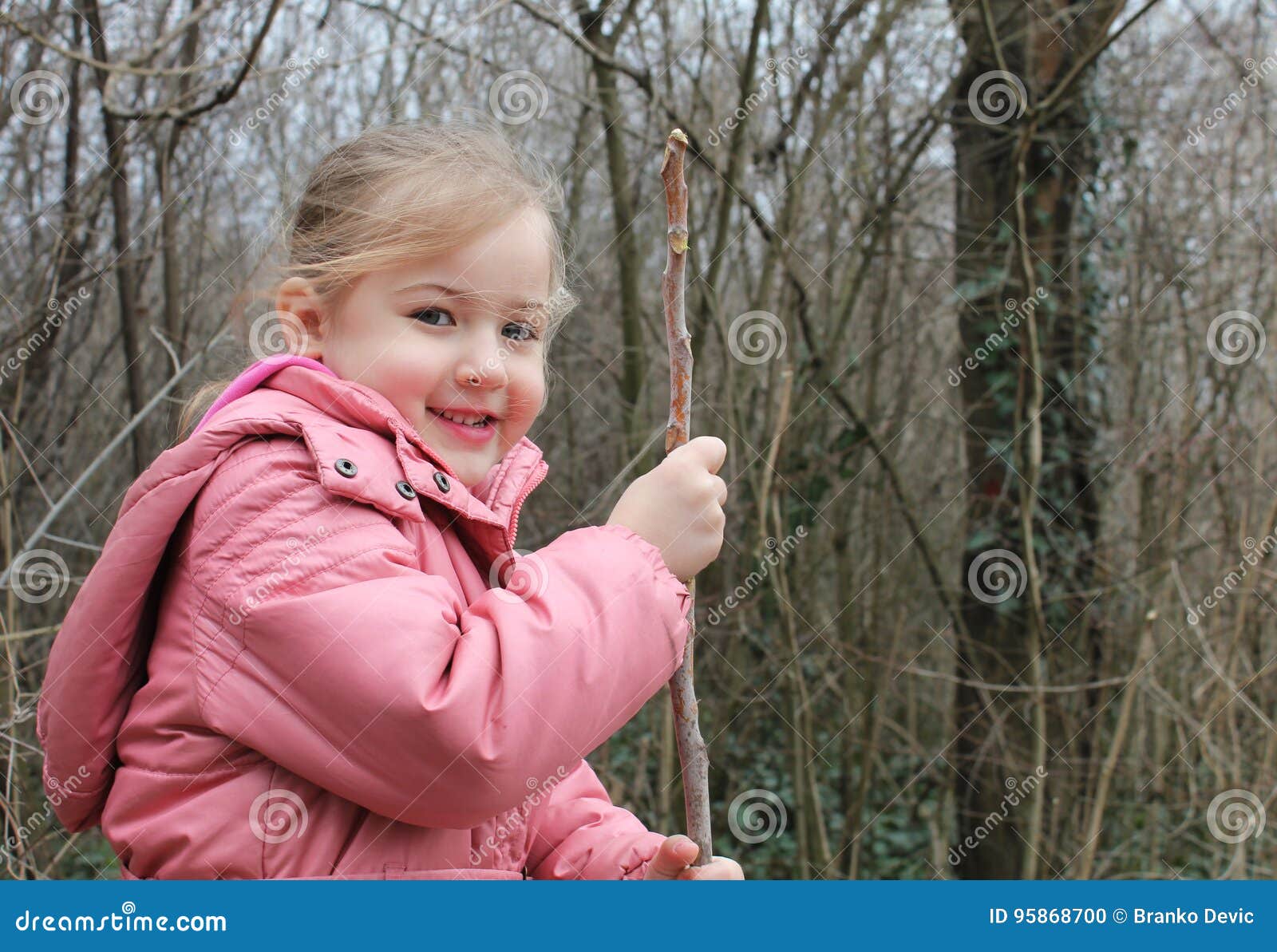 Beautiful Little Girl Posing with the Stick Stock Photo - Image of ...