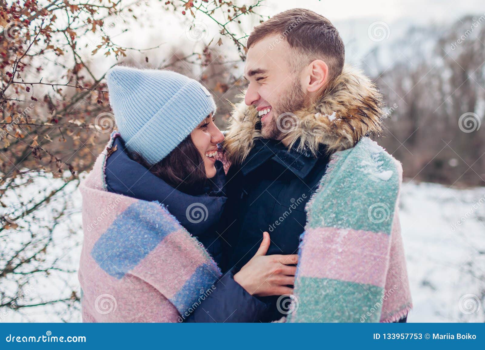 Beautiful Loving Couple Hugging And Laughing In Winter Forest People