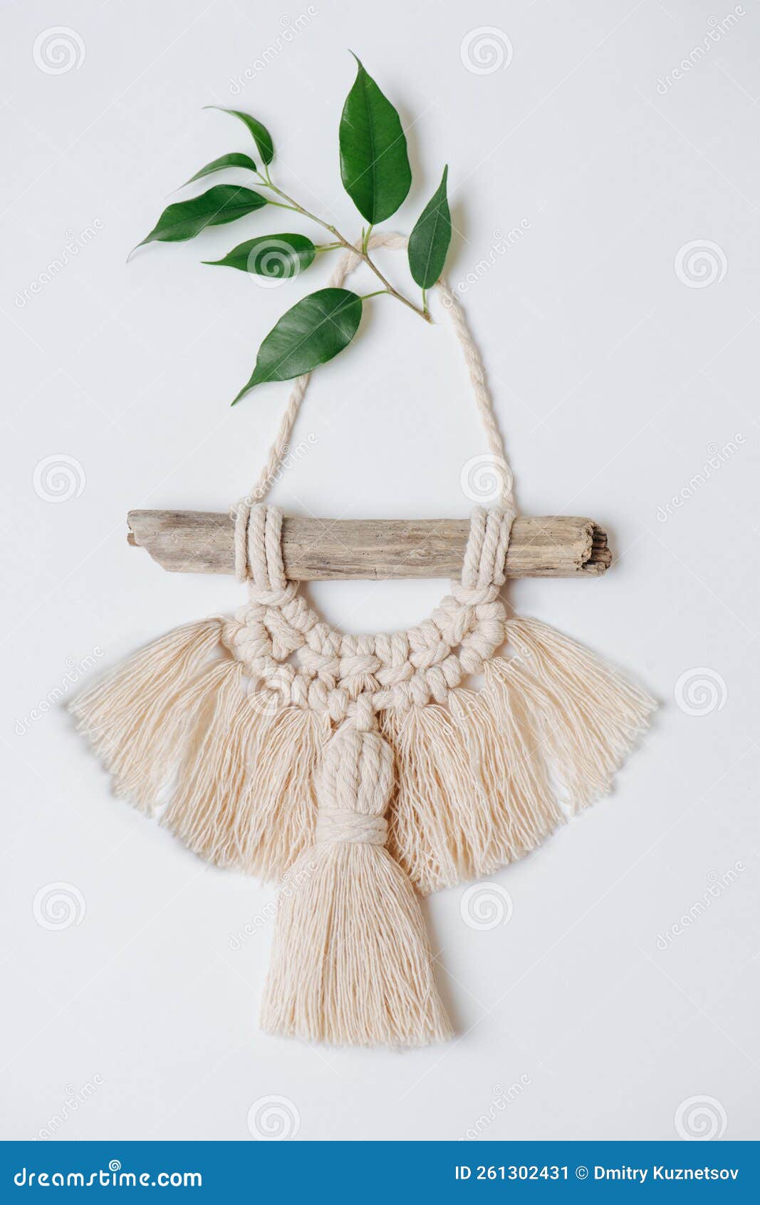 Beautiful Macrame Hanging on a White Wall, Decorated with Leaves. Stock ...