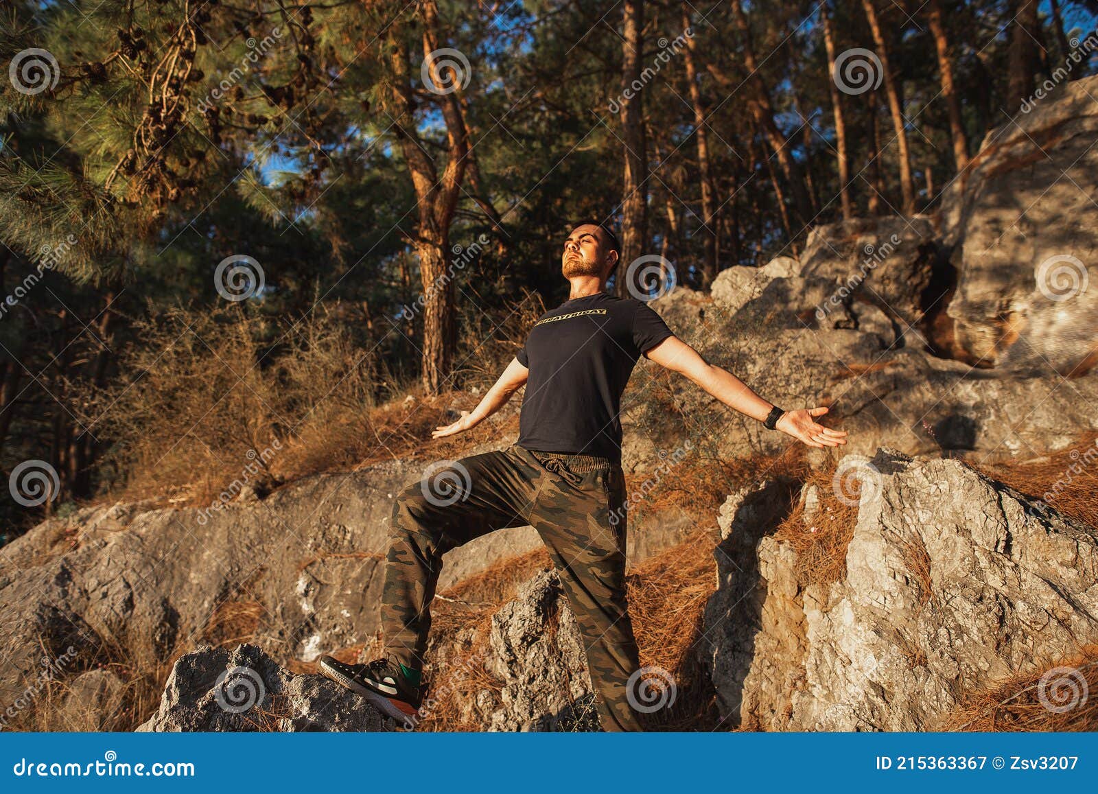 Beautiful Man Does Breathing Exercises at Sunset in Mountain Pine ...
