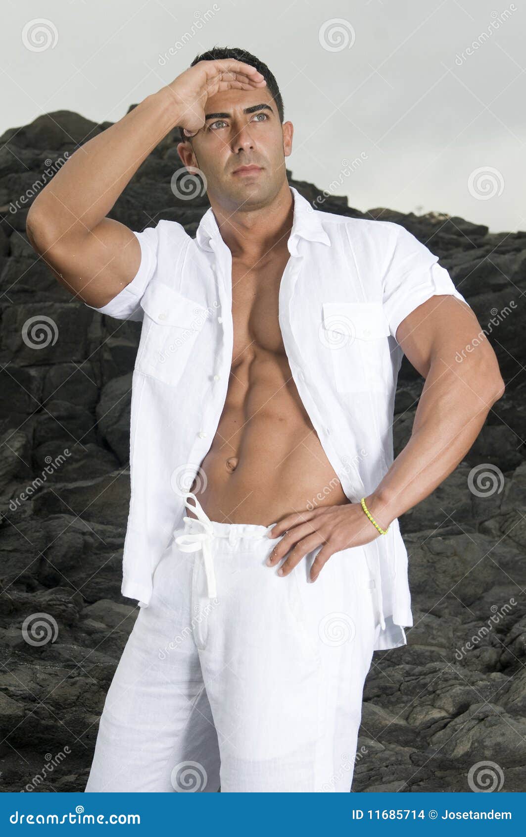 Beautiful man on the rocks stock photo. Image of happy - 11685714