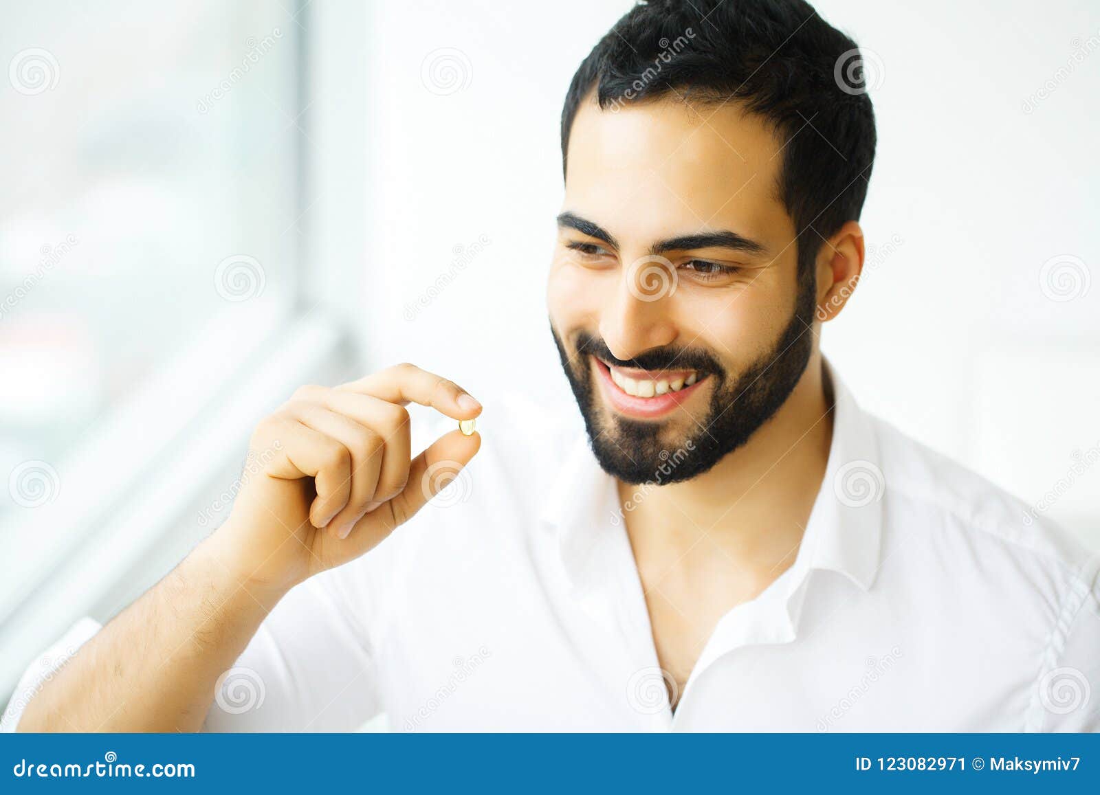 Beautiful Man Taking Pill, Medicine. Vitamins and Supplements Stock ...