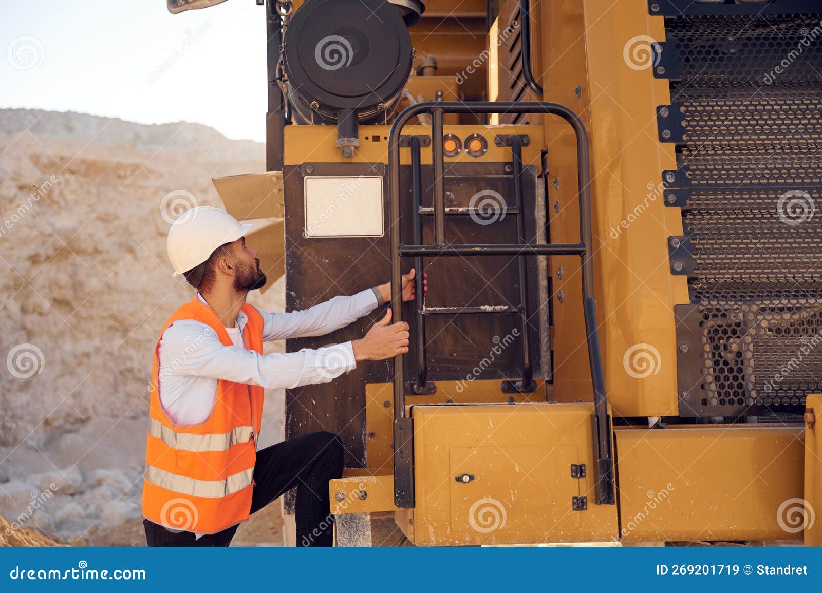 Beautiful Man in Uniform is Working in the Quarry at Daytime. with Haul ...