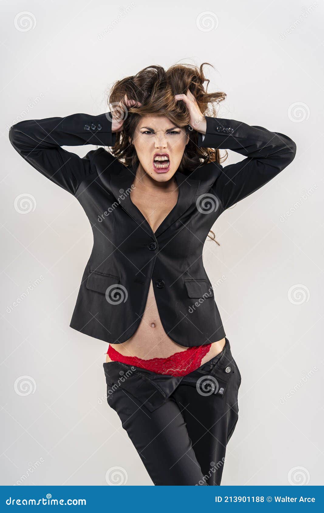 Mixed Race Model Poses in a Business Suit in a Studio Environment Stock ...