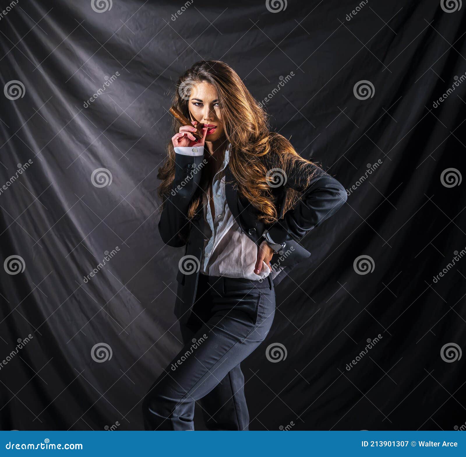Mixed Race Model Poses in a Business Suit in a Studio Environment Stock ...