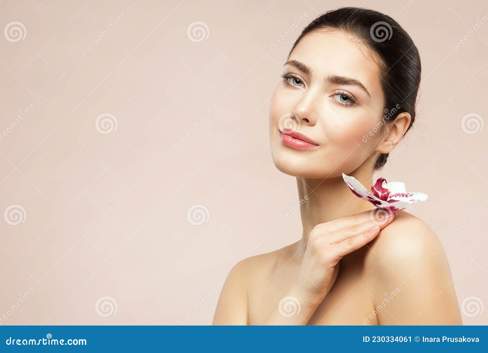 Beautiful Model Girl Holding Orchid Flower On Shoulder Beauty Woman