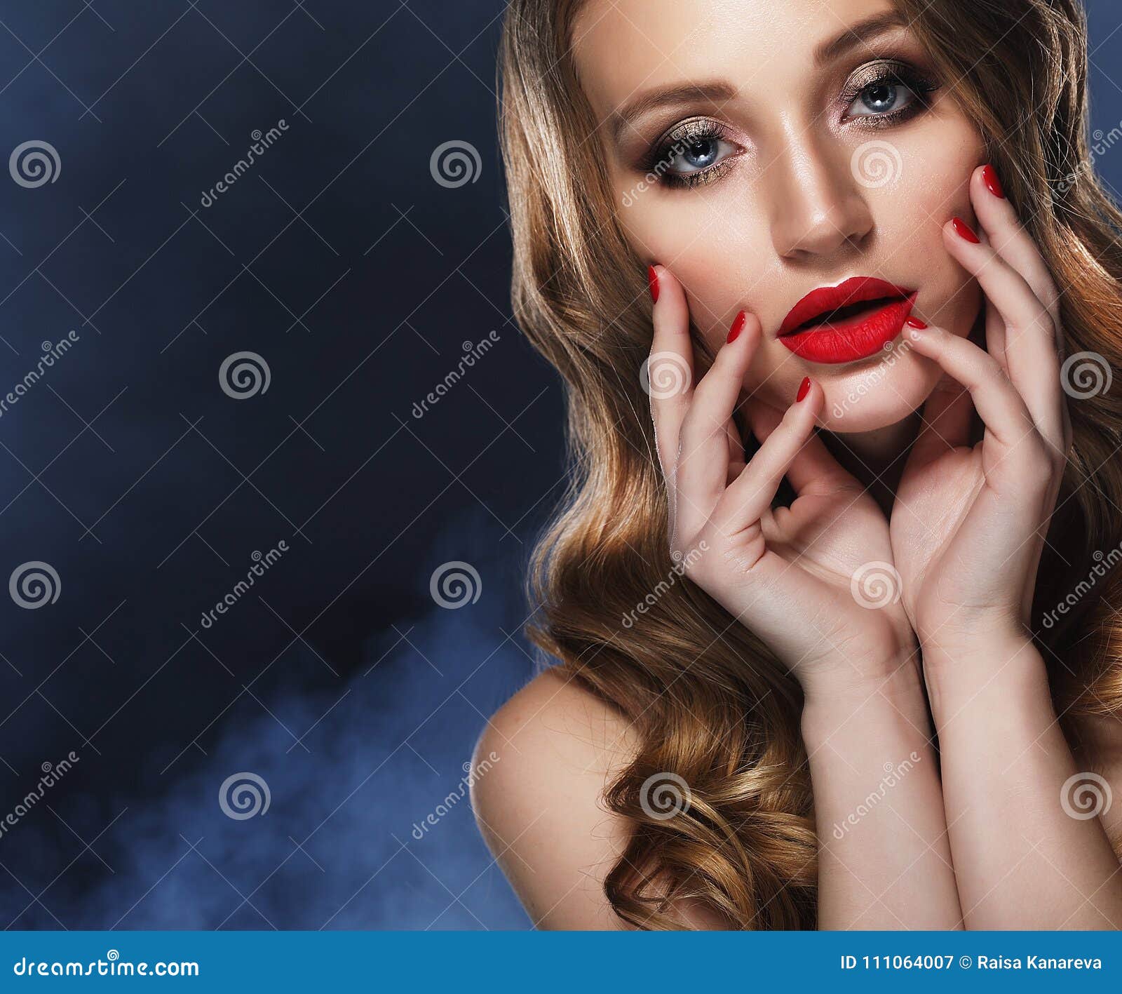 Beautiful Model Girl With Long Curly Hair And Red Lips Red Mani Stock