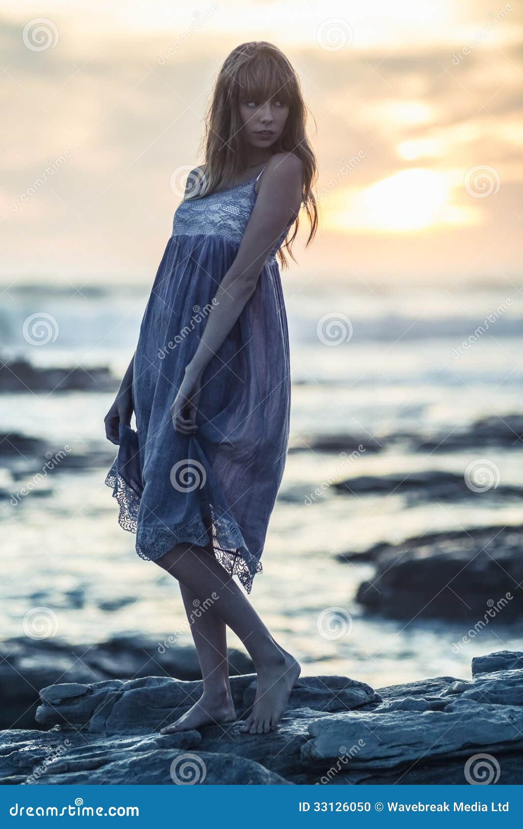 Beautiful Model Posing on Rocks by the Sea Stock Photo - Image of ...
