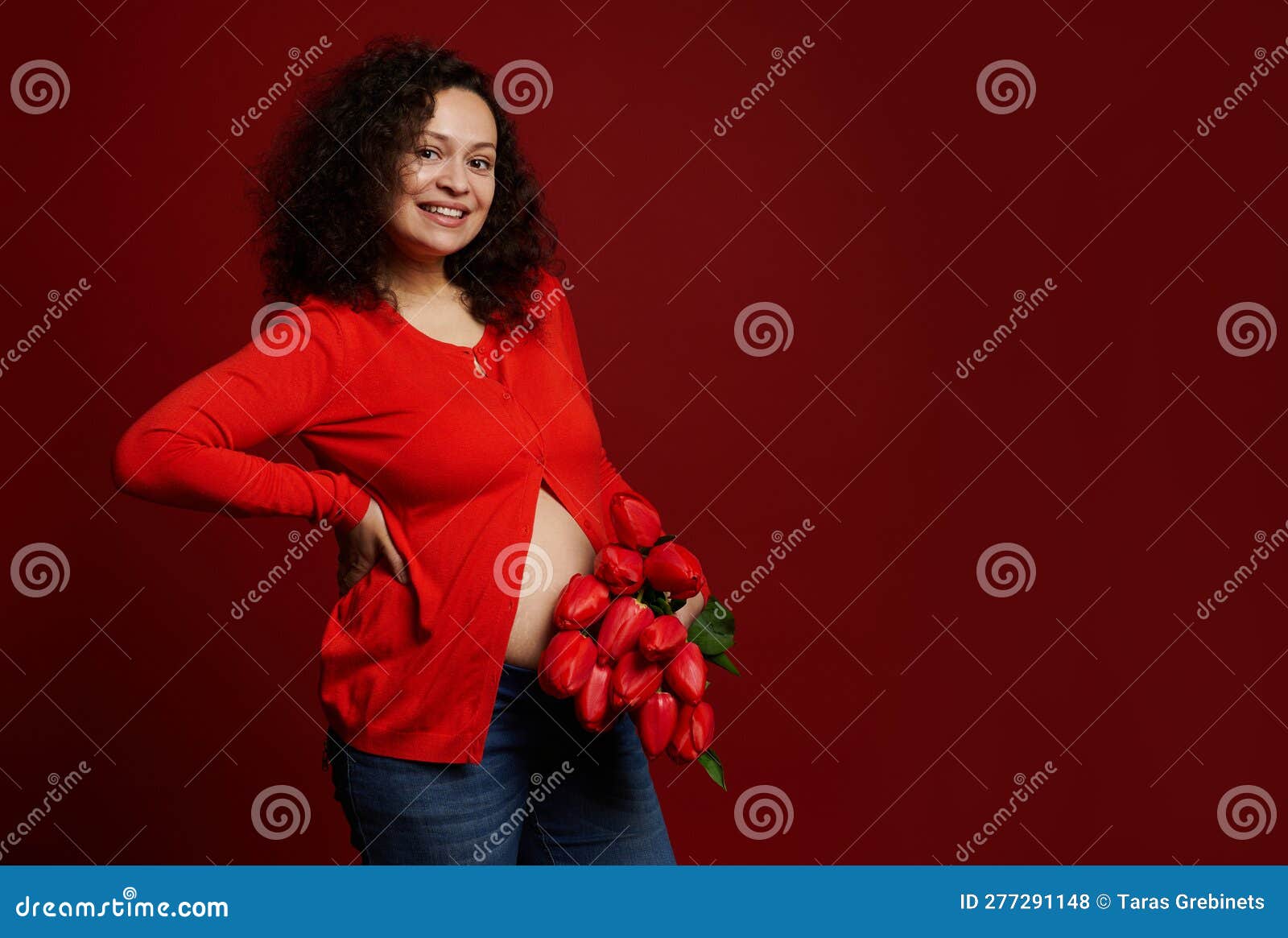 Beautiful Multi Ethnic Pregnant Woman Smiling At Camera Posing With A