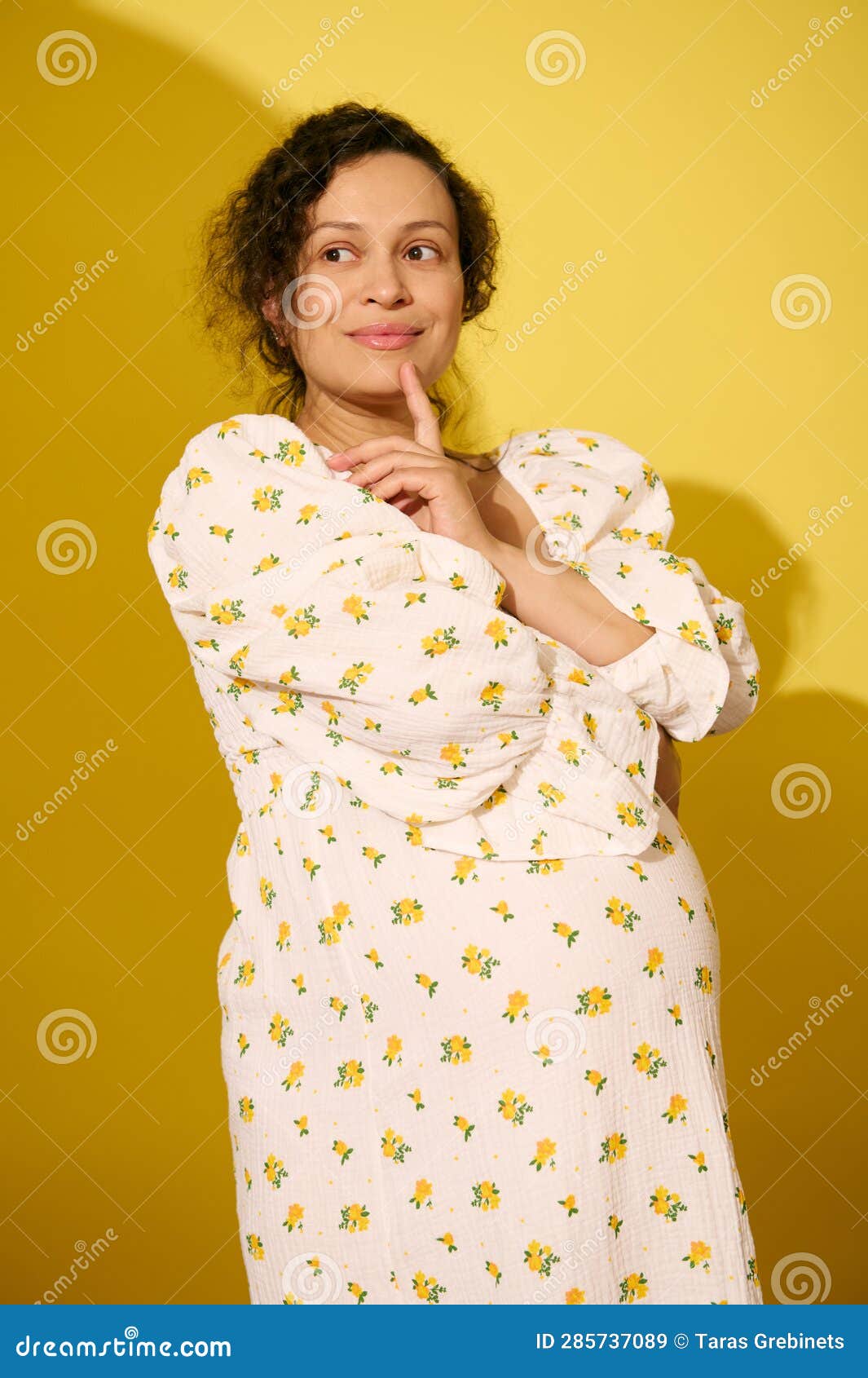 Beautiful Multi Ethnic Pregnant Woman In Sundress Thoughtfully Looking