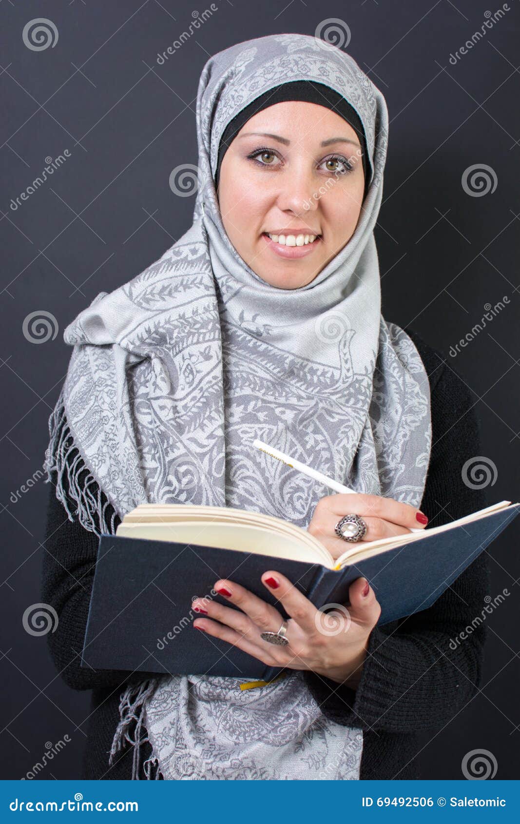 Beautiful Muslim Woman Writing Stock Photo - Image of arabic, female ...