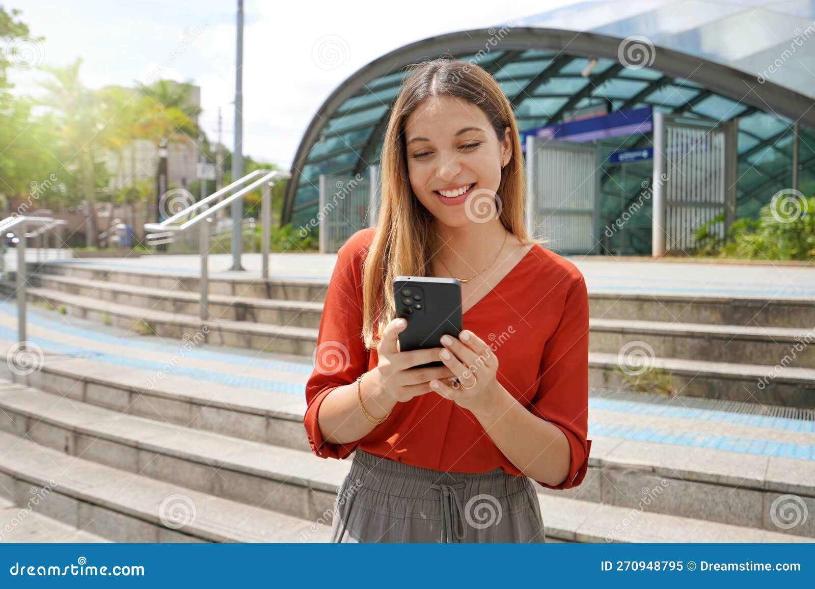 Beautiful Native Digital Girl Using Mobile Phone in the City Stock ...