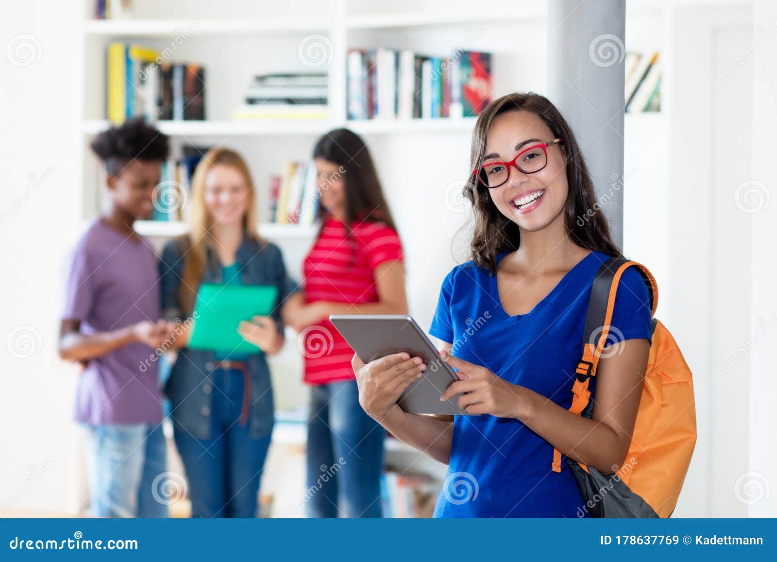 Beautiful Nerdy Female Student with Tablet Computer with Group of Multi ...