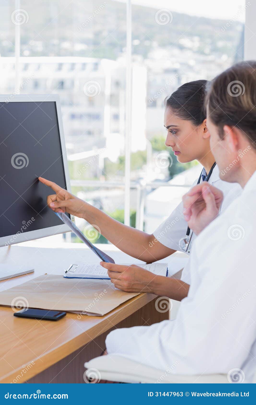 Beautiful Nurse Showing the Screen of a Computer To a Colleague Stock ...